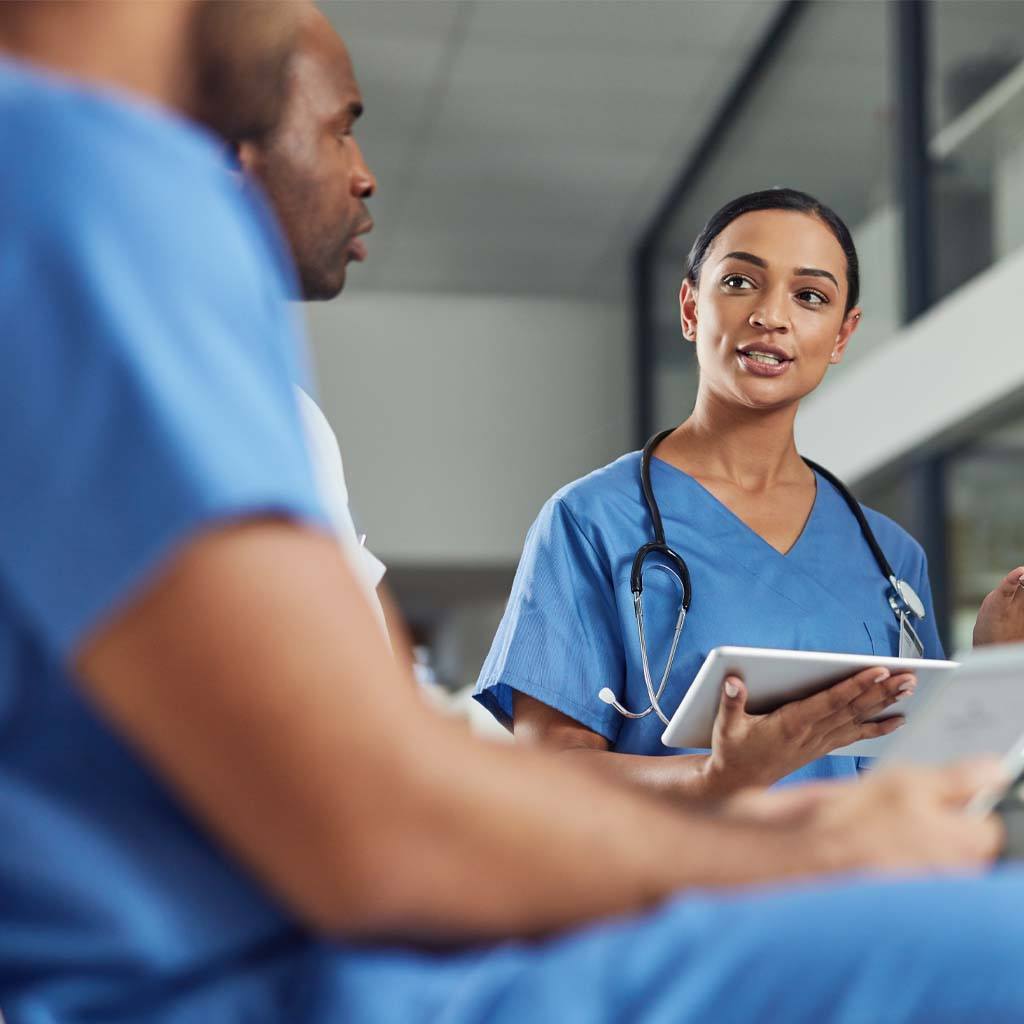 Shot of a group of medical practitioners having a discussion in a hospital. Shot of a group of medical practitioners having a discussion in a hospital.